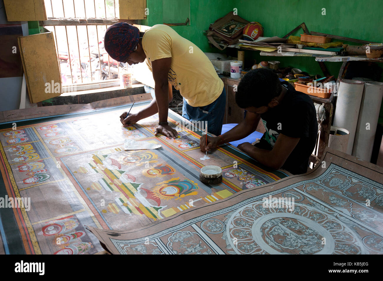 Pattachitra artists painting traditional Odishan scroll Thia Badhia in ...