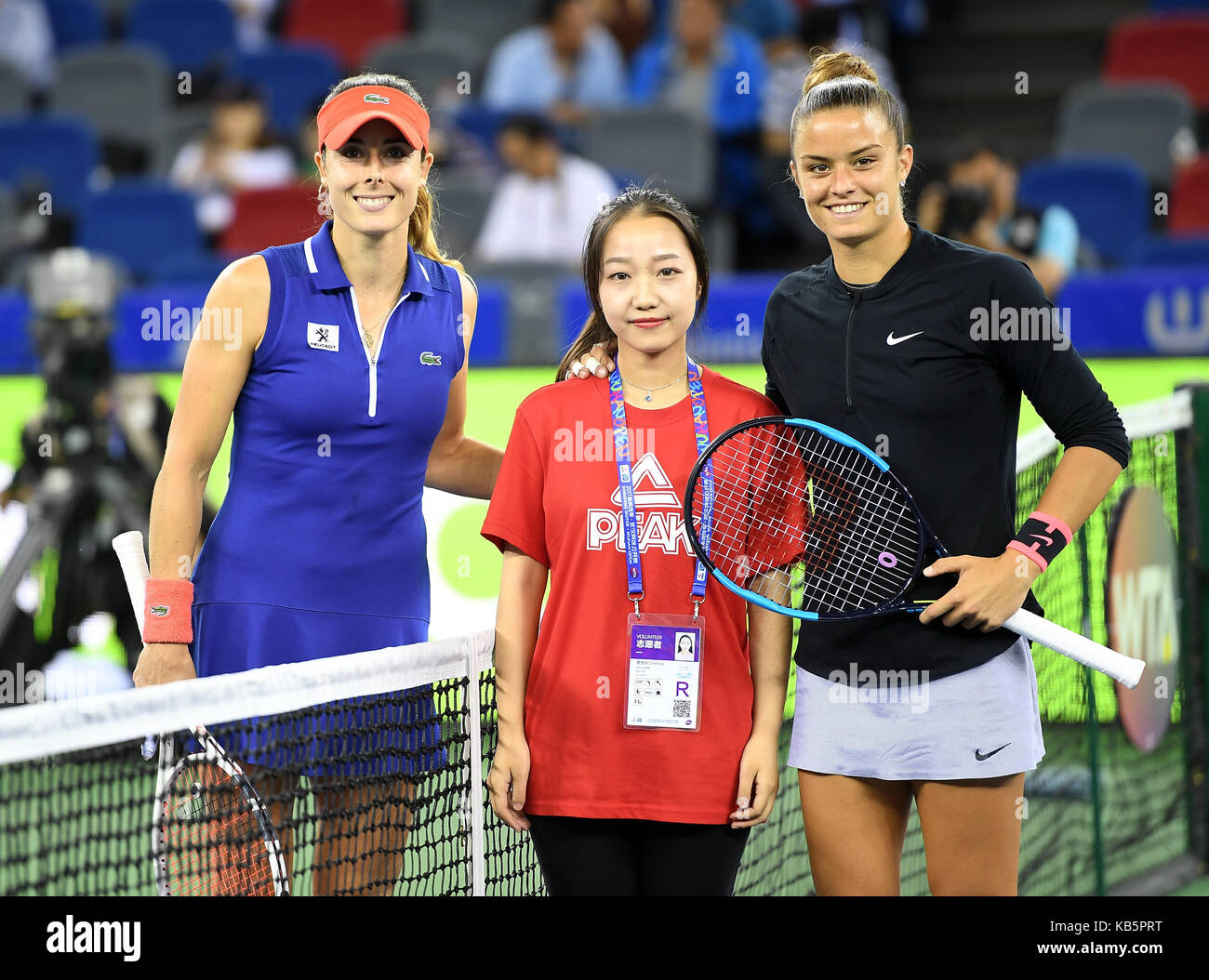 Wuhan, China. 28th Sep, 2017. Alize Cornet (L) of France and Maria ...