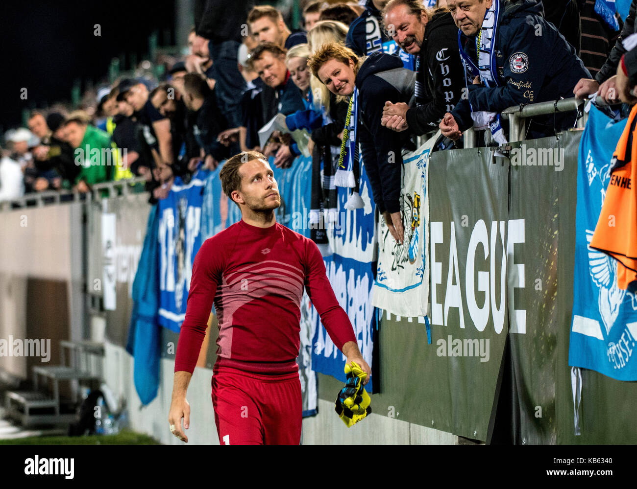 Hoffenheim's goalkeeper Olivier Baumann walks past the fans after the ...