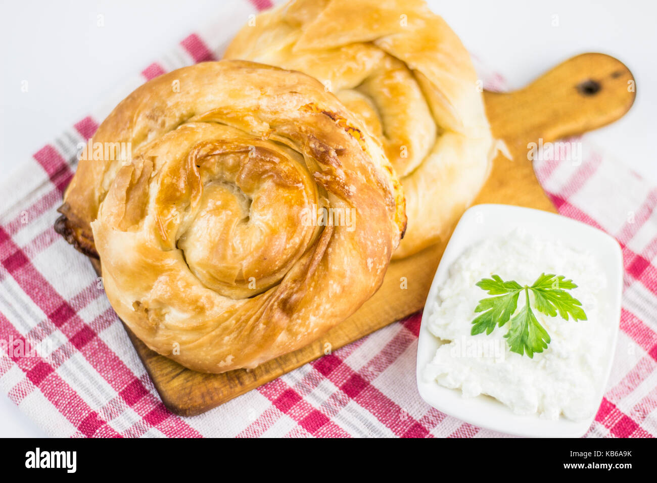 Cheese burek/sirnica composition on white background Stock Photo - Alamy