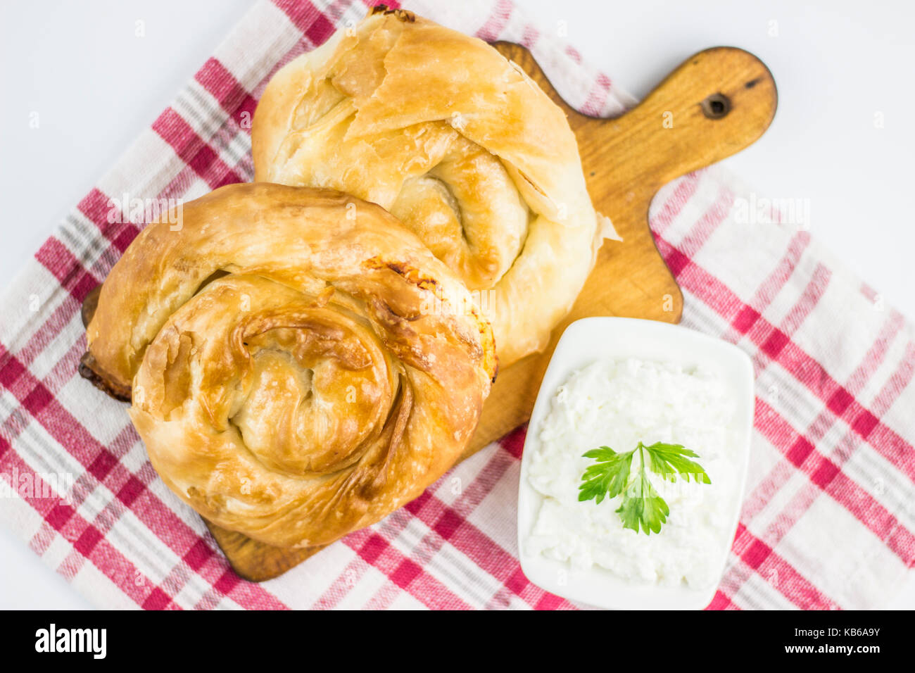 Cheese burek/sirnica composition on white background Stock Photo - Alamy
