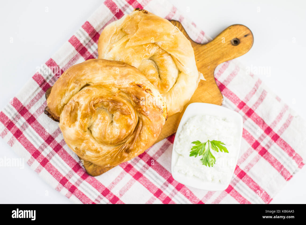 Cheese burek/sirnica composition on white background Stock Photo - Alamy