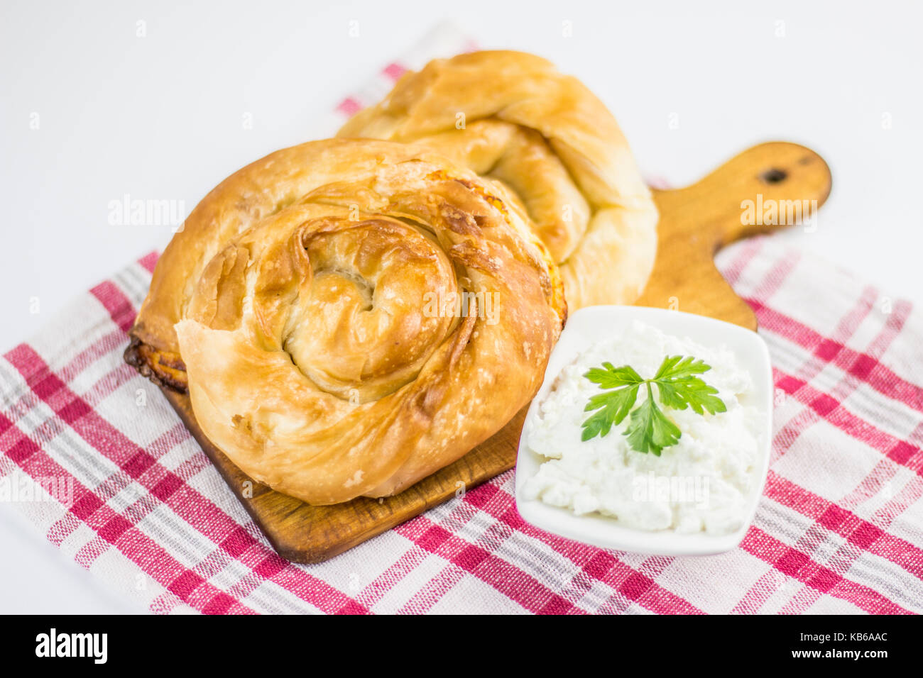 Cheese burek/sirnica composition on white background Stock Photo - Alamy