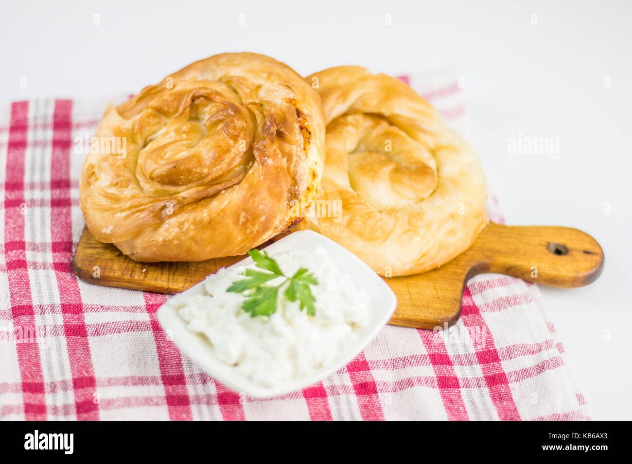Cheese burek/sirnica composition on white background Stock Photo - Alamy