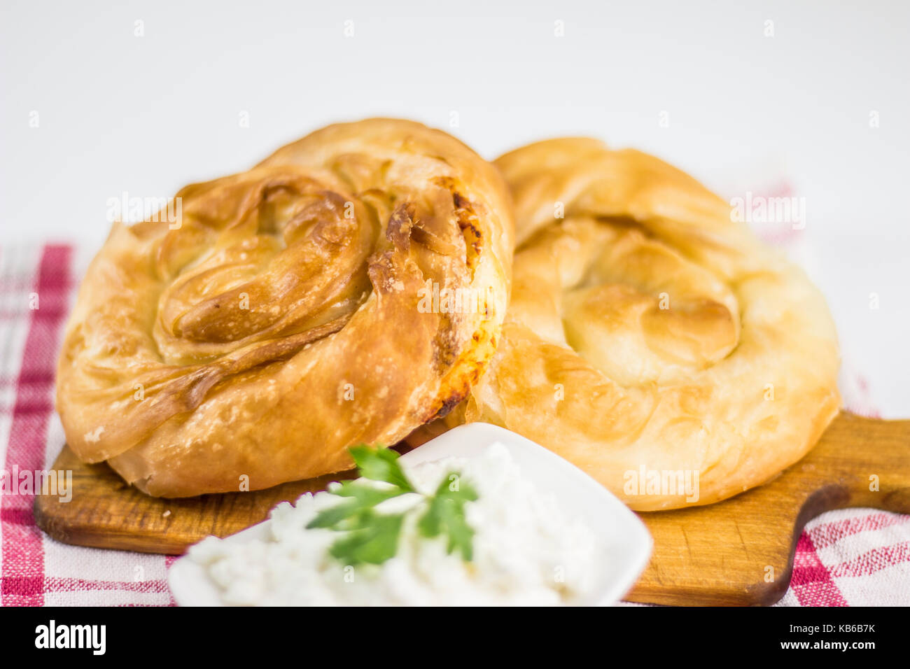 Cheese burek/sirnica composition on white background Stock Photo - Alamy