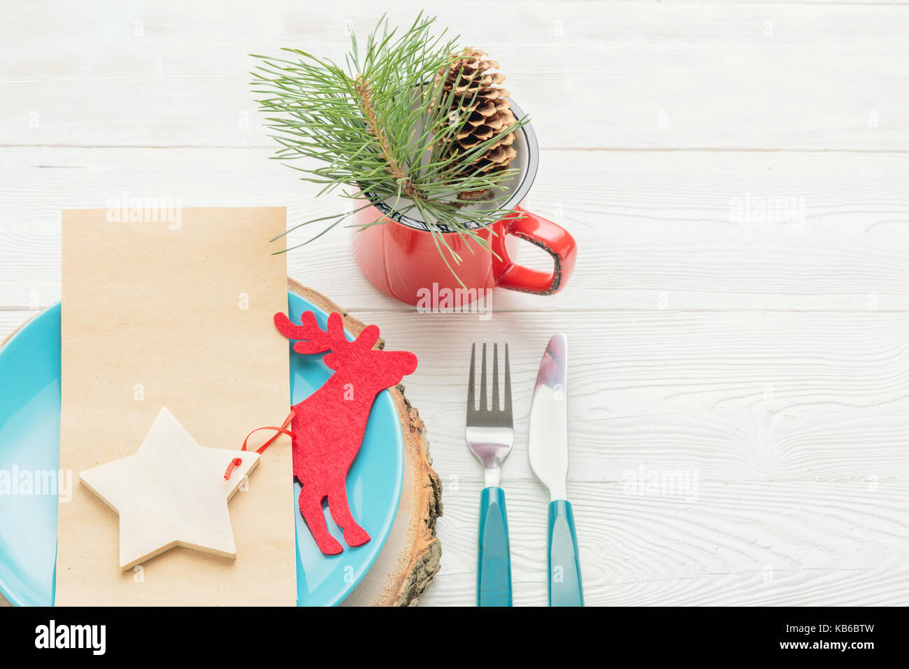 Christmas dinner table setting on white background Stock Photo - Alamy
