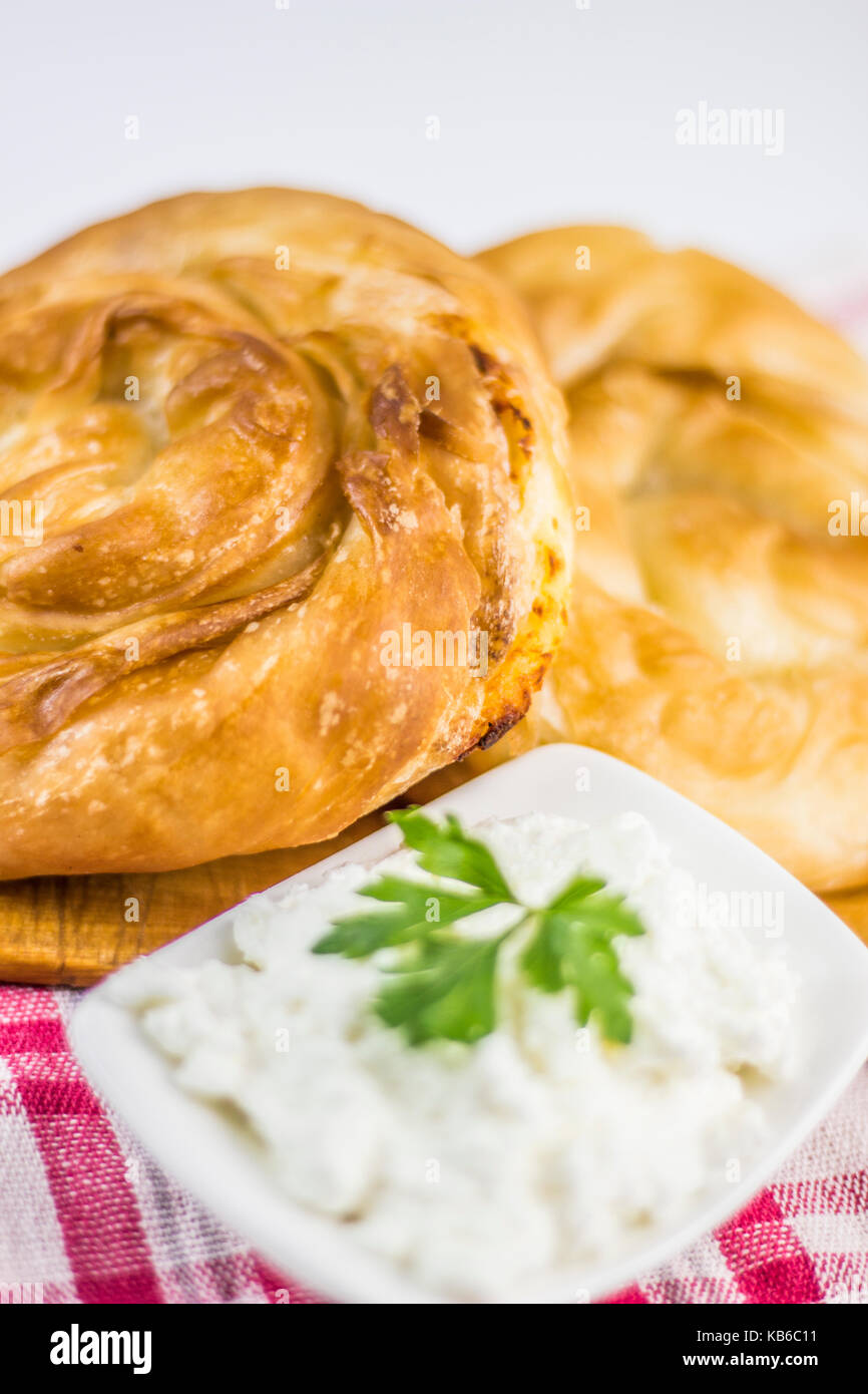Cheese burek/sirnica composition on white background Stock Photo - Alamy