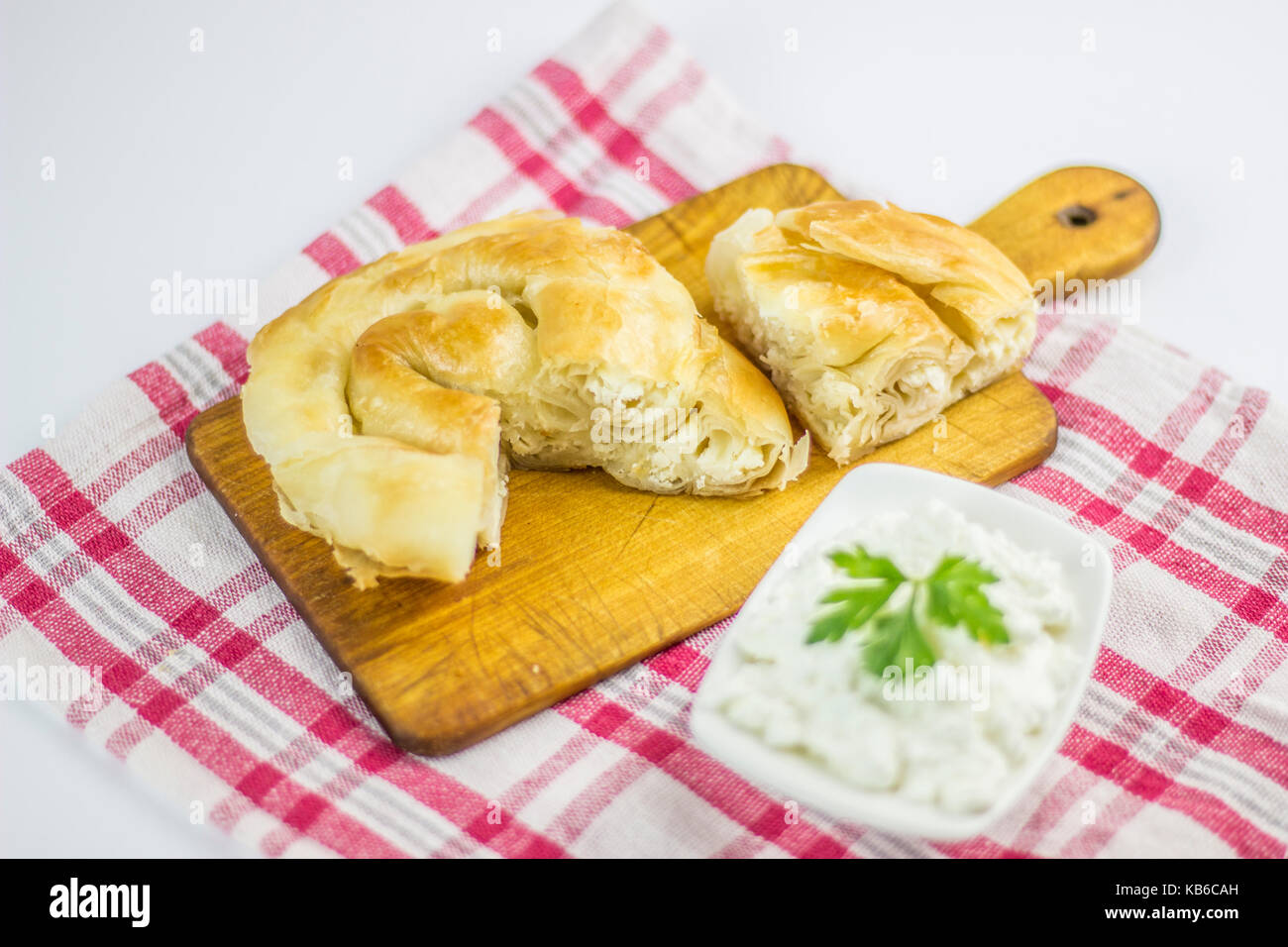 Cheese burek/sirnica composition on white background Stock Photo - Alamy