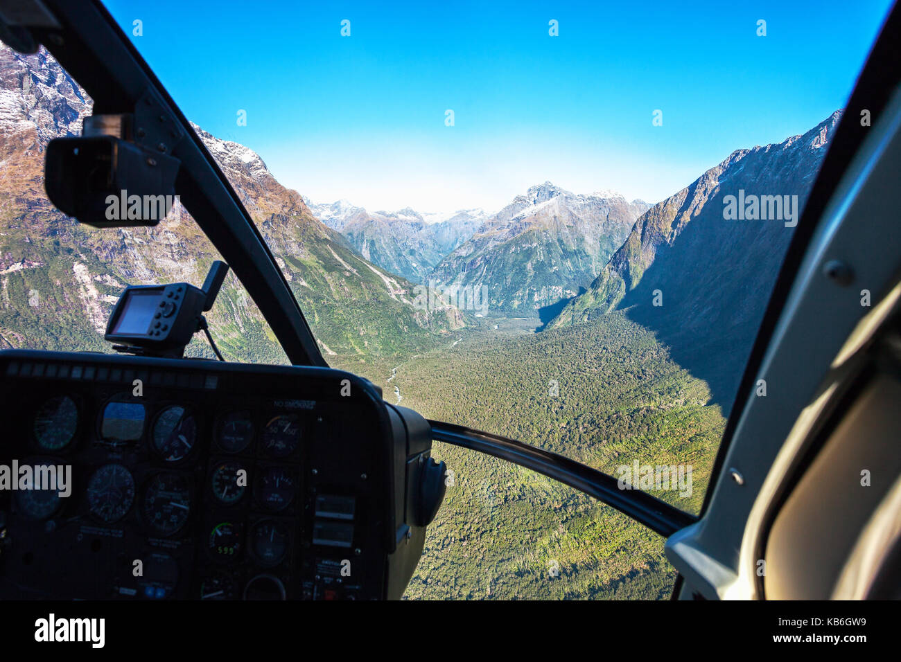 Scenic helicopter flight with view from cockpit, Milford Sound ...