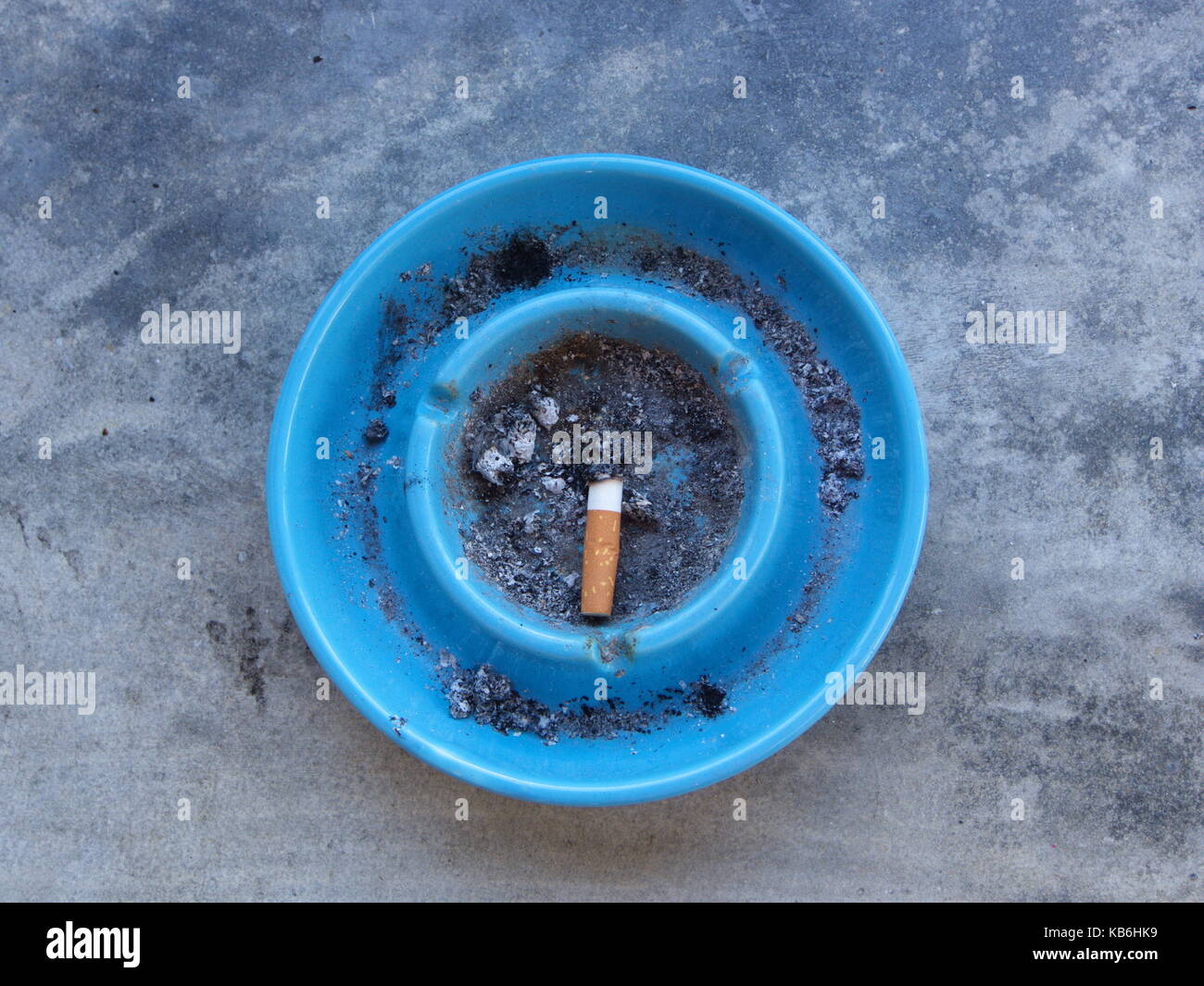 an Ashtray and Cigarette. a Smoking Place with a wooden table Stock ...