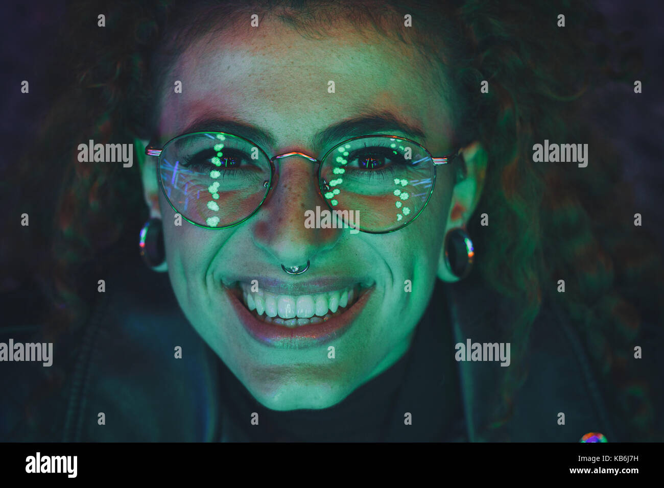 Portrait of a young woman at night illuminated with color lights Stock ...