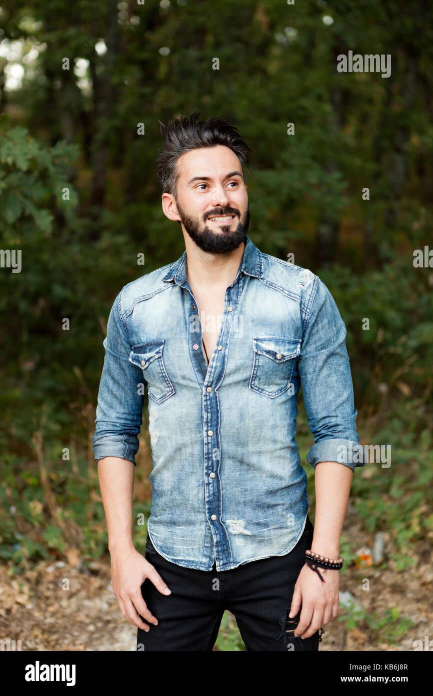 Young handsome bearded hipster man in the field Stock Photo - Alamy