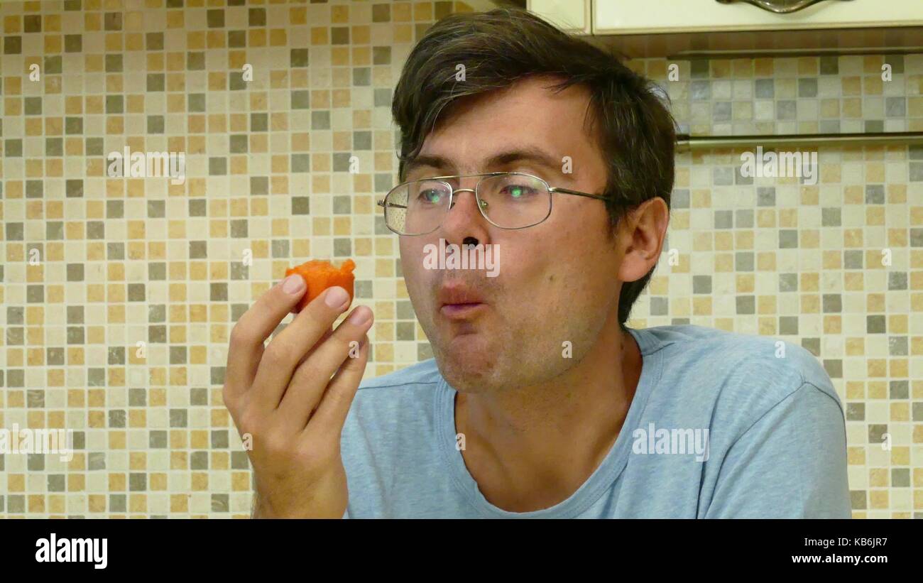 Boy biting carrot hi-res stock photography and images - Alamy