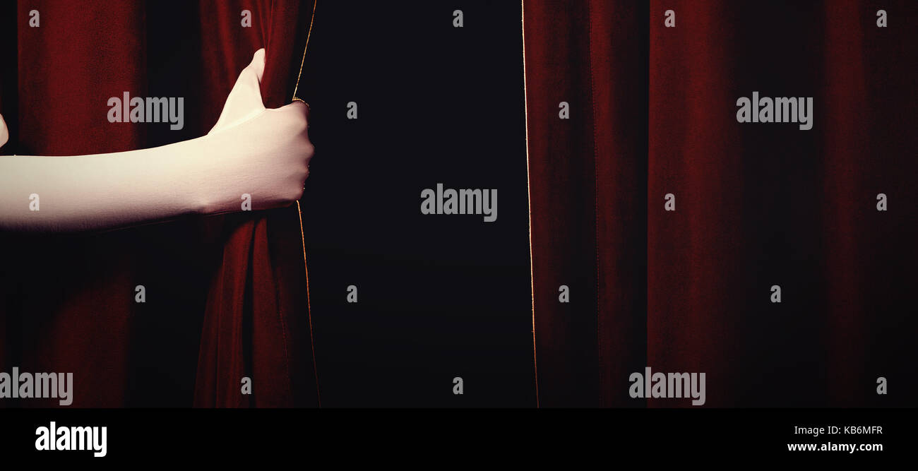 Cropped hand of performer holding curtain at stage Stock Photo - Alamy