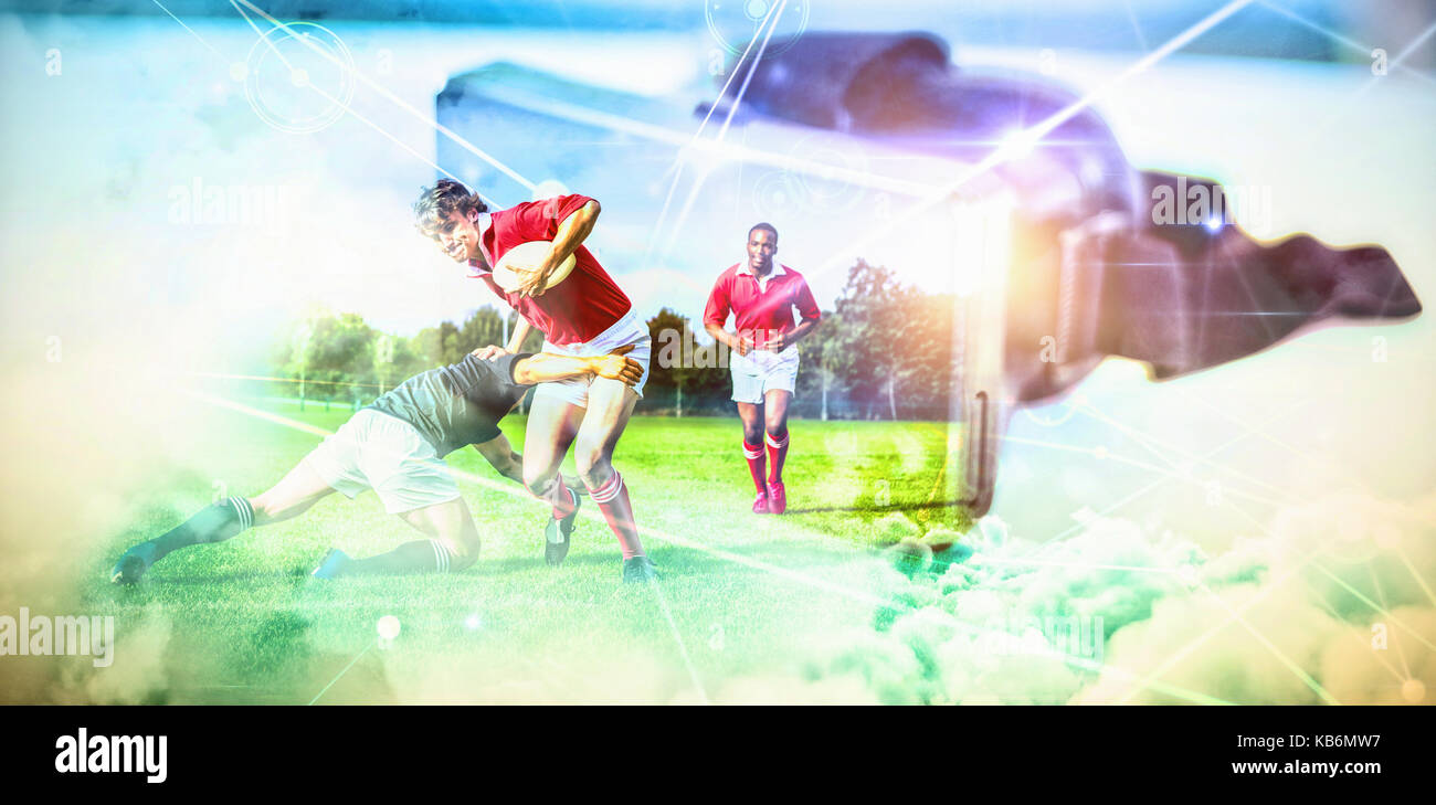 Rugby players tackling during game against virtual reality headset on ...