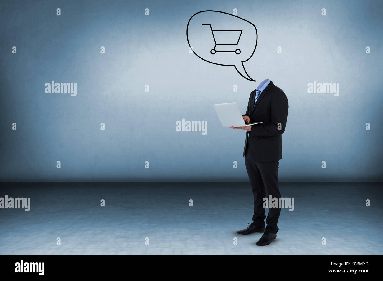 Headless businessman using laptop against grey room Stock Photo - Alamy
