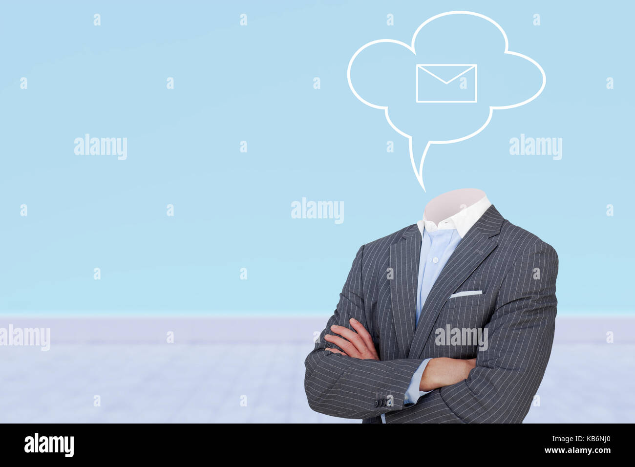 Headless businessman in suit standing with arms crossed against blue ...