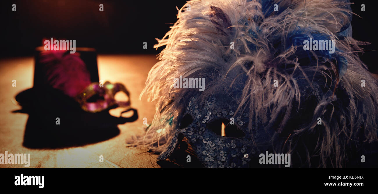 Masquerade masks with glove and hat on stage Stock Photo - Alamy