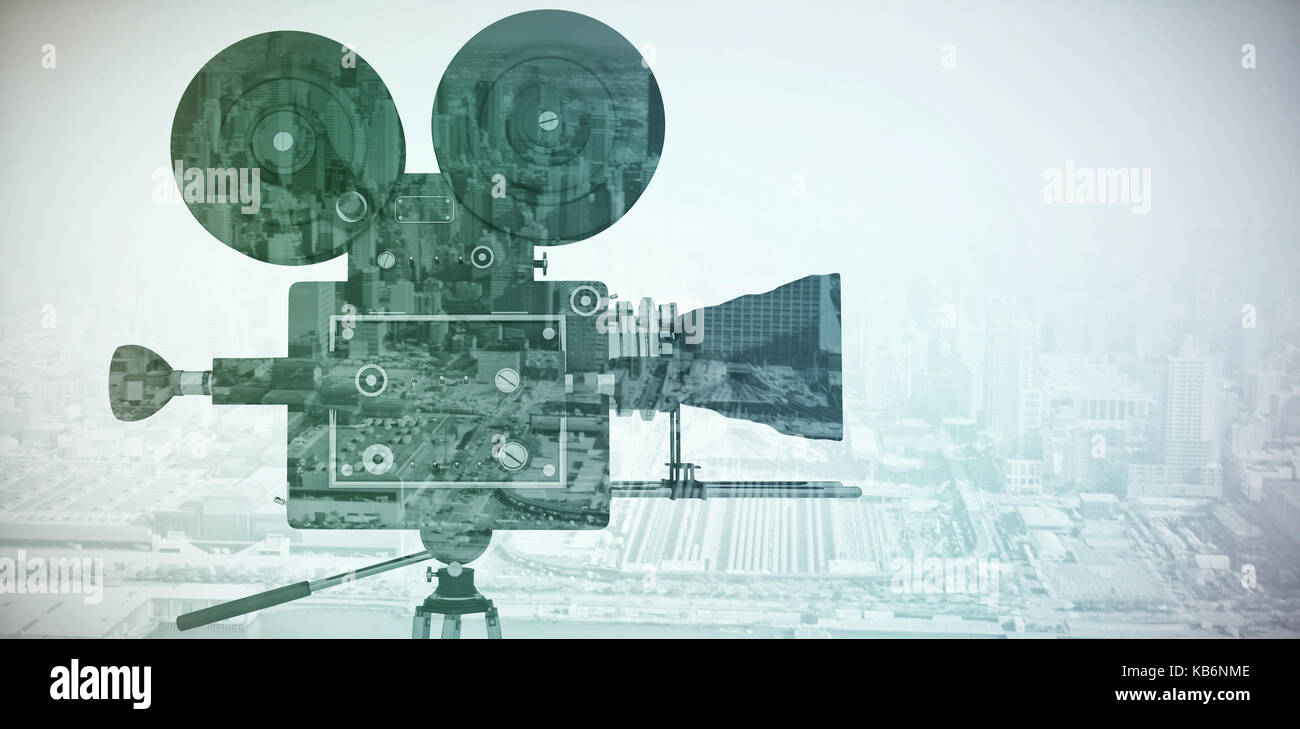 Film reel camera with tripod against high angle view of city by river ...