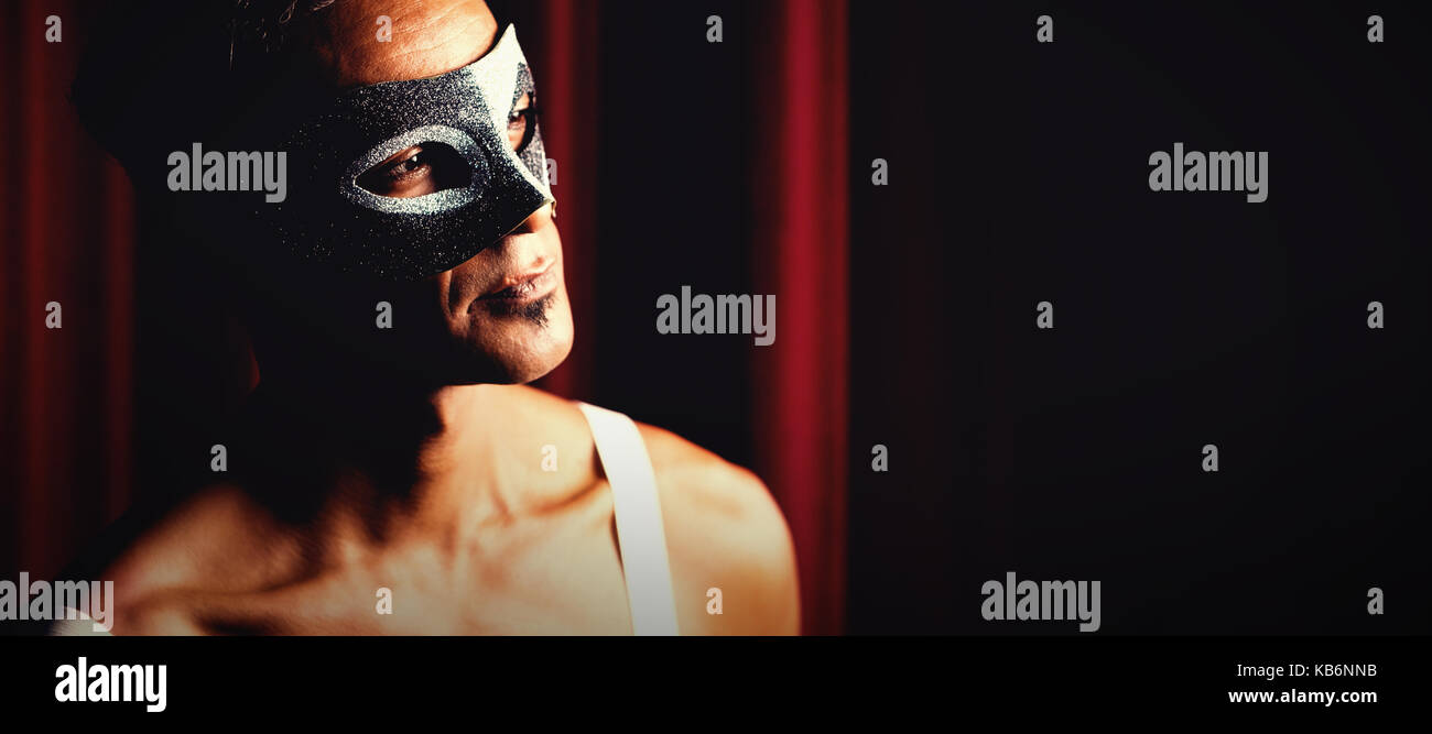 Thoughtful man in masquerade mask at stage Stock Photo - Alamy