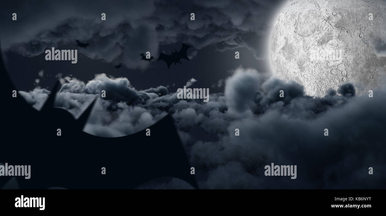 Digital image of silhouette bat against moon shining between clouds ...
