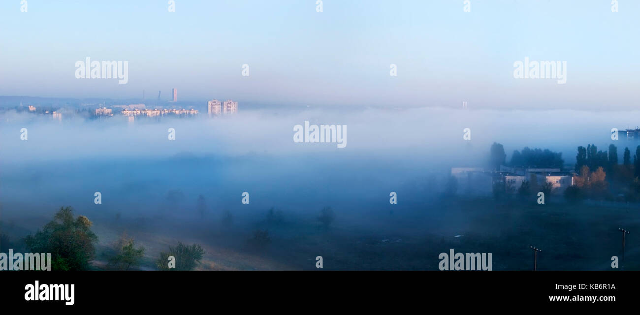 Fog over city. Panorama Stock Photo - Alamy