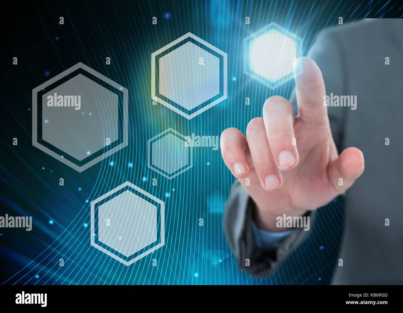 Digital composite of Hand touching icons interface of hexagons glowing ...