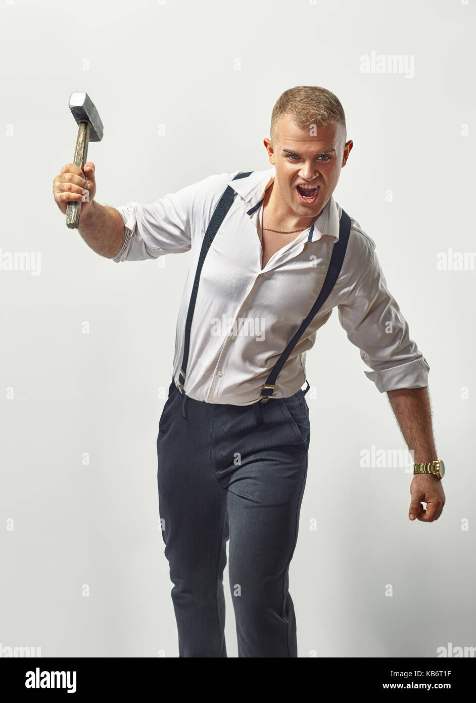 Angry man with hammer Stock Photo - Alamy