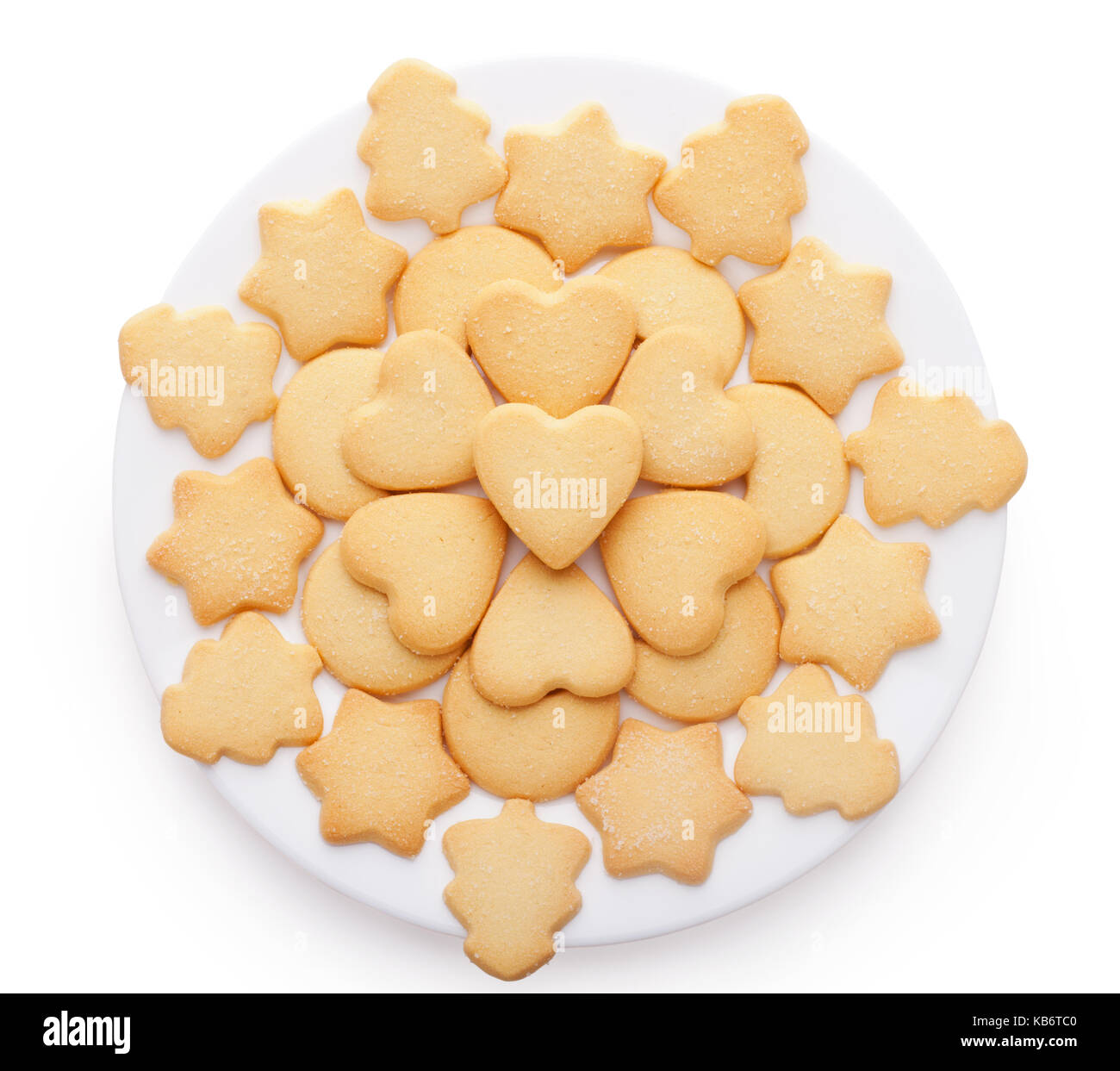 cookies with different shapes on plate isolated on white background ...