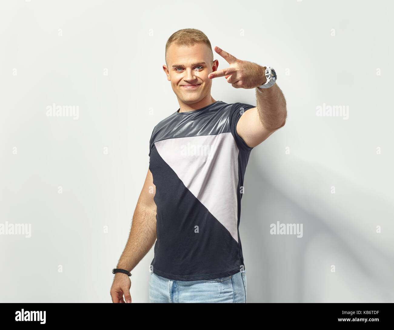 Man showing victory sign hi-res stock photography and images - Alamy