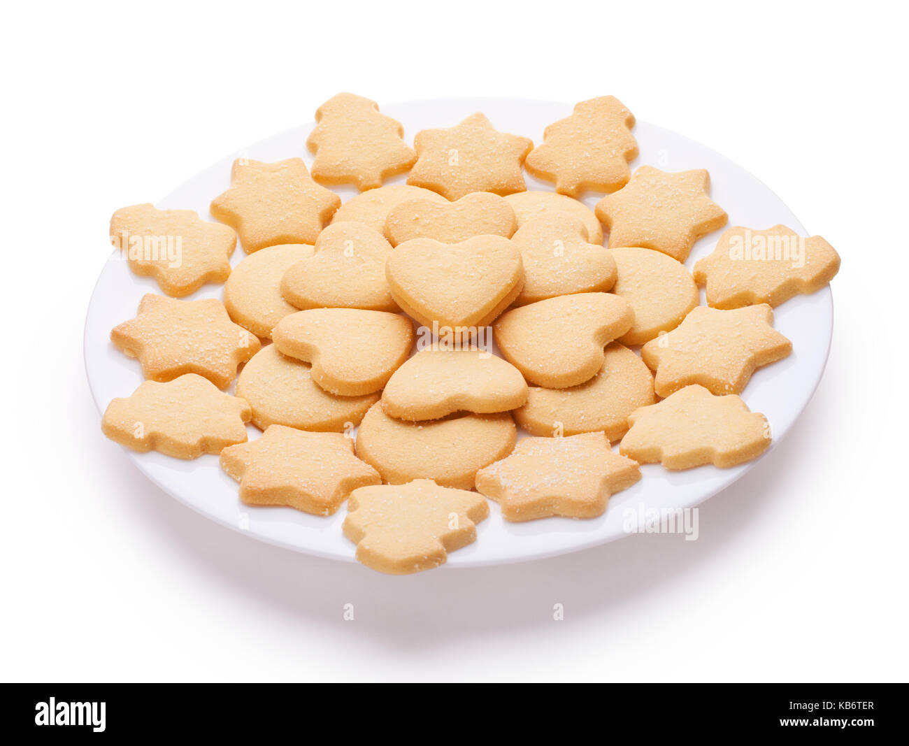 cookies with different shapes on plate isolated on white background ...