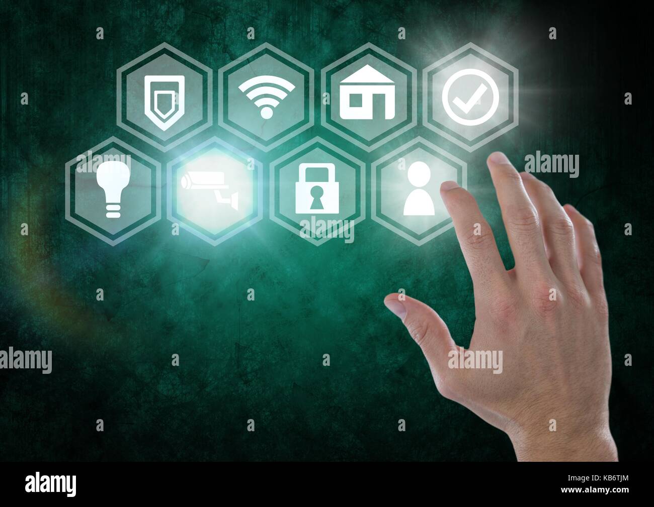 Digital composite of Hand touching icons interface of internet of ...