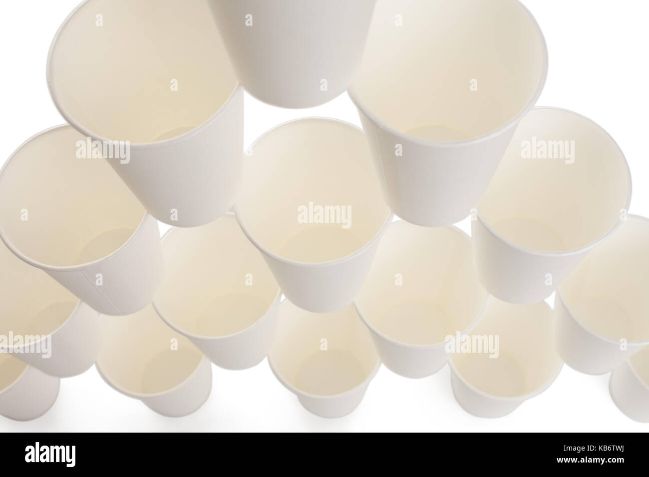 Top view pyramid of white disposable paper cups isolated on white ...