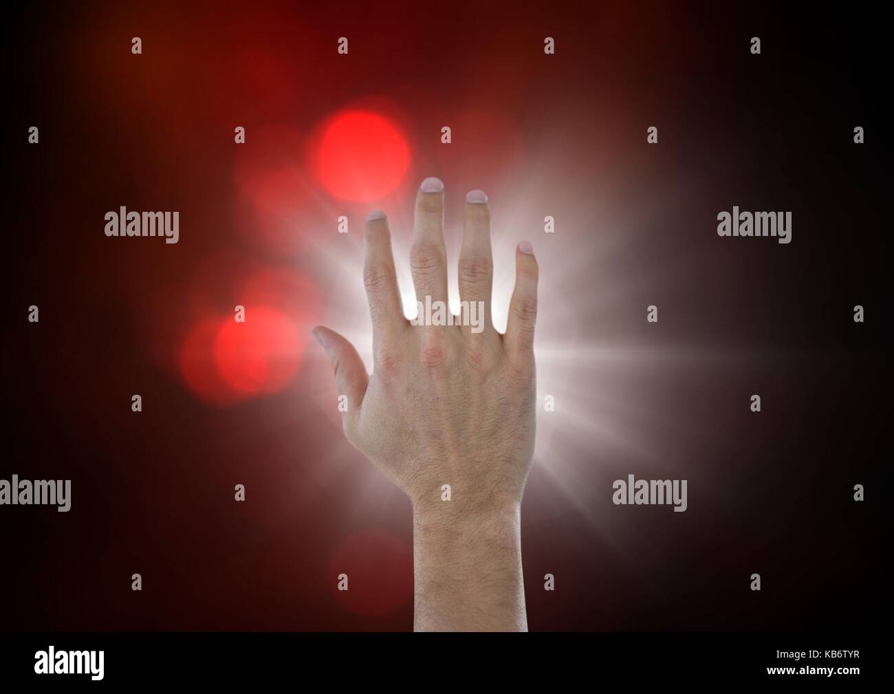 Digital composite of Hand touching the air with glow Stock Photo - Alamy
