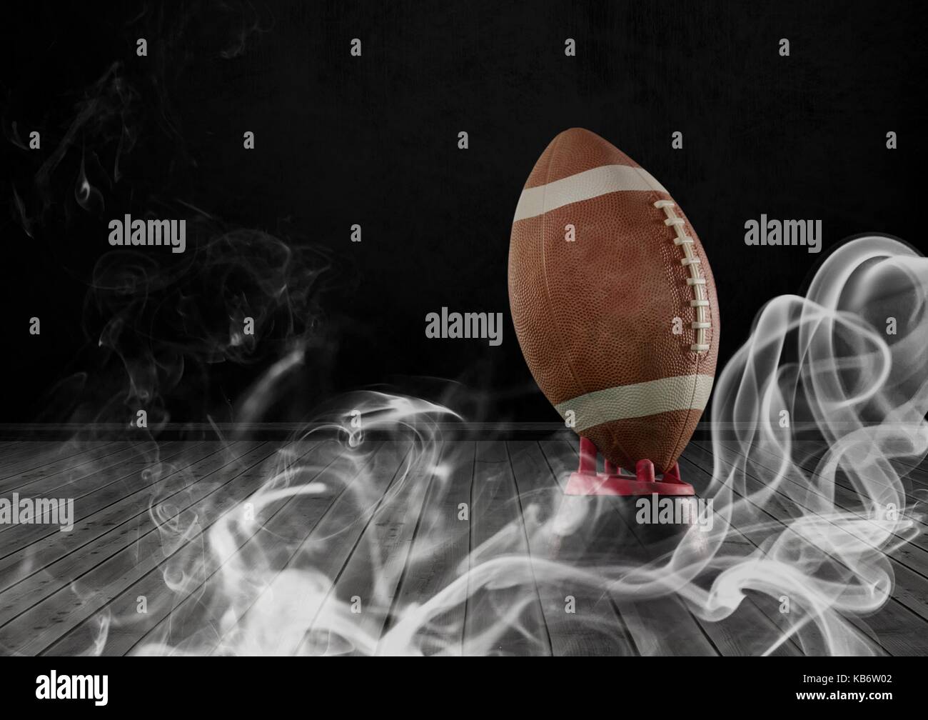 Digital composite of american football in smoke Stock Photo - Alamy