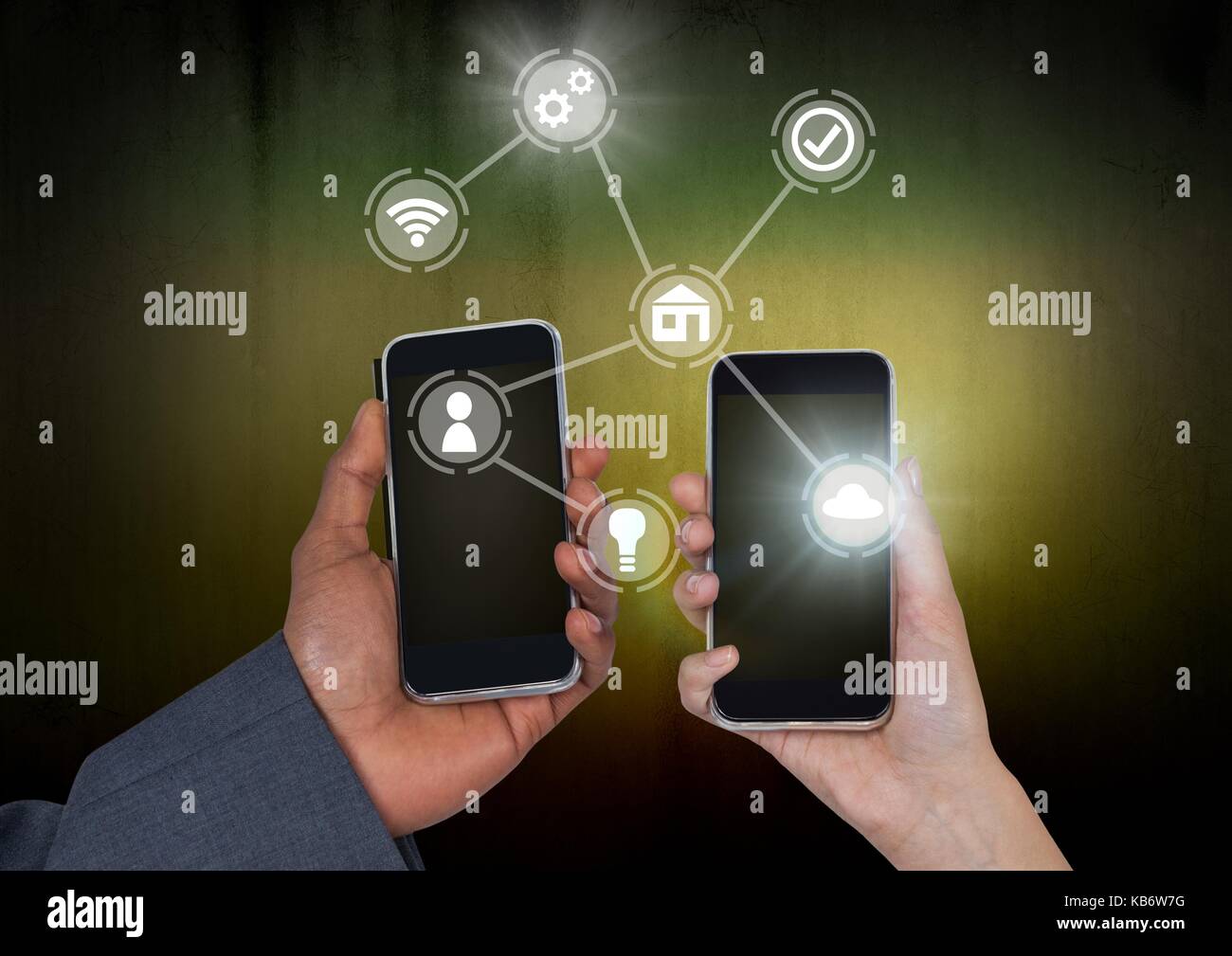 Digital composite of Hands holding phones with icons interface of ...
