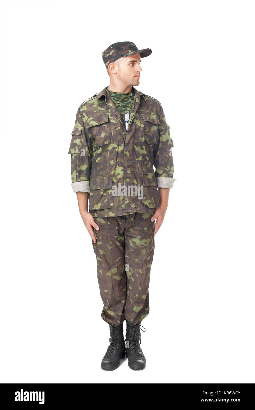 Full length portrait of young army soldier standing in attention and ...