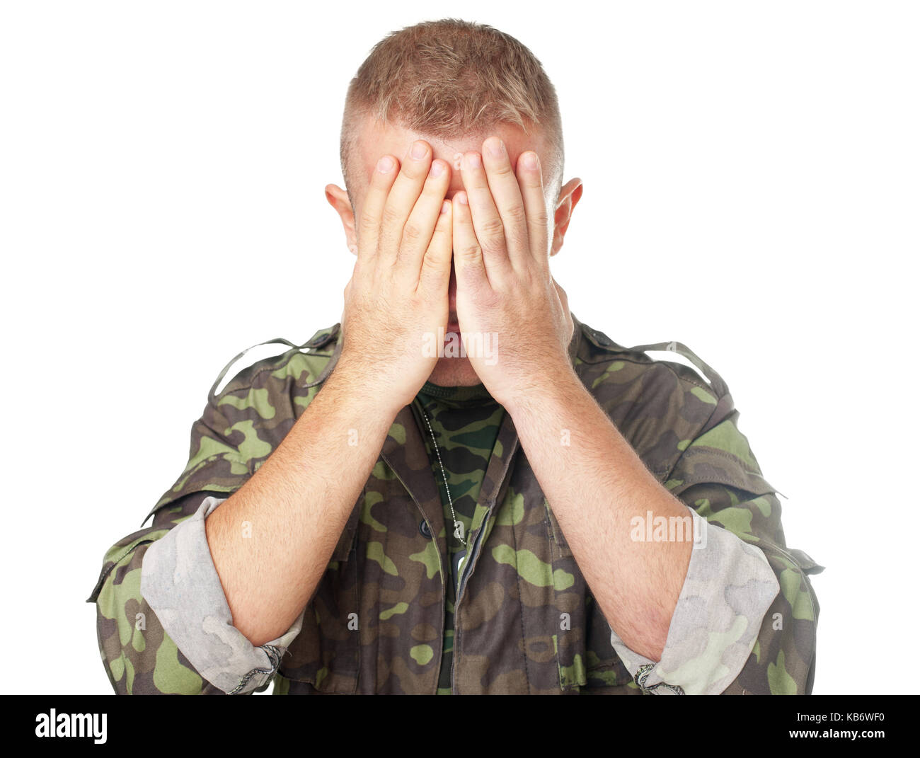 Closeup portrait of army soldier closing eyes with hands isolated on ...