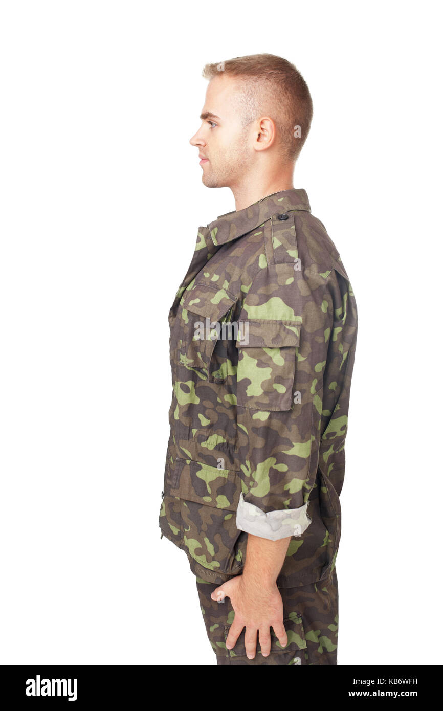 side view of young army soldier standing in attention isolated on white ...