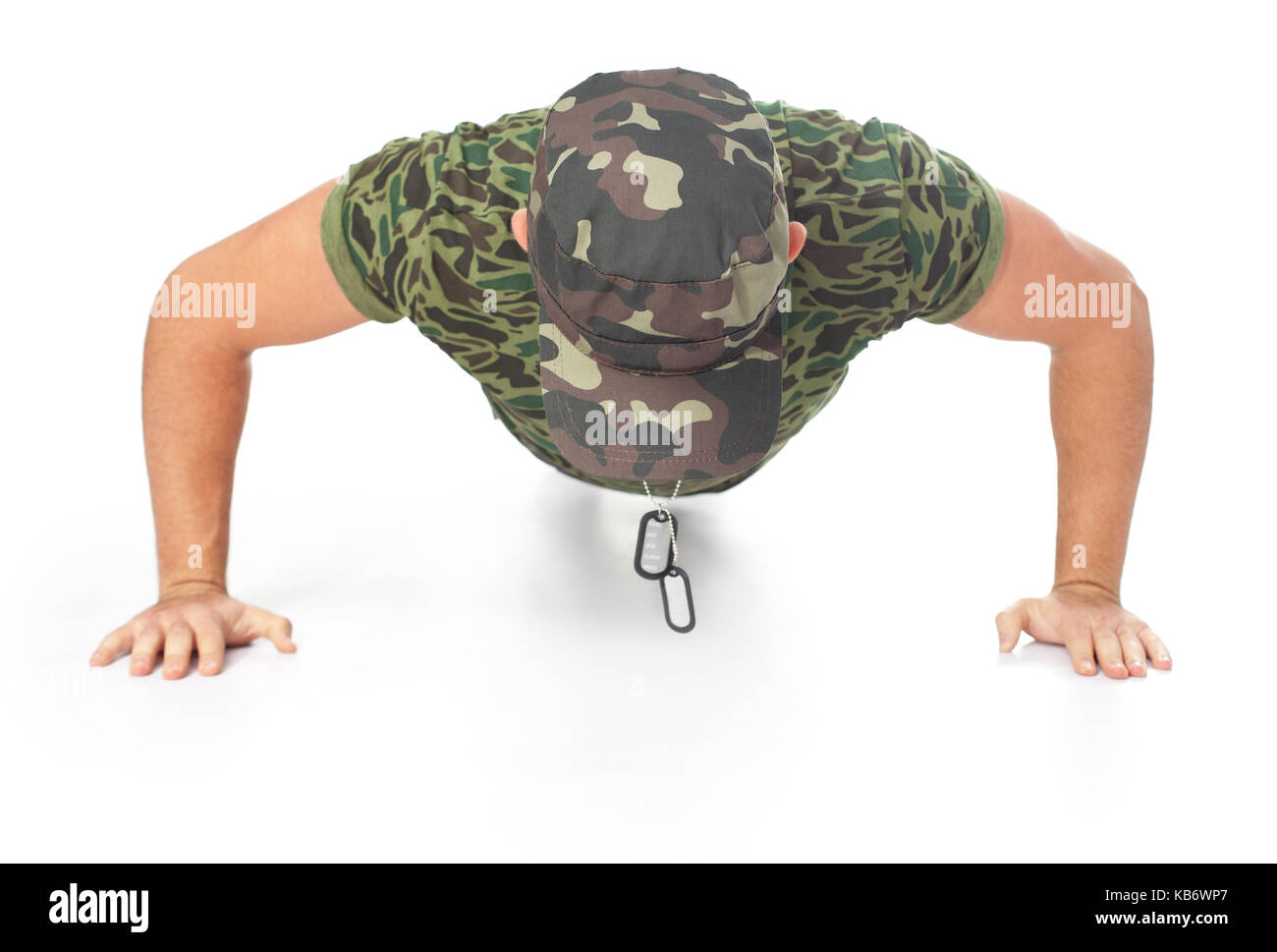 Young army soldier doing push up isolated on white background.Front ...