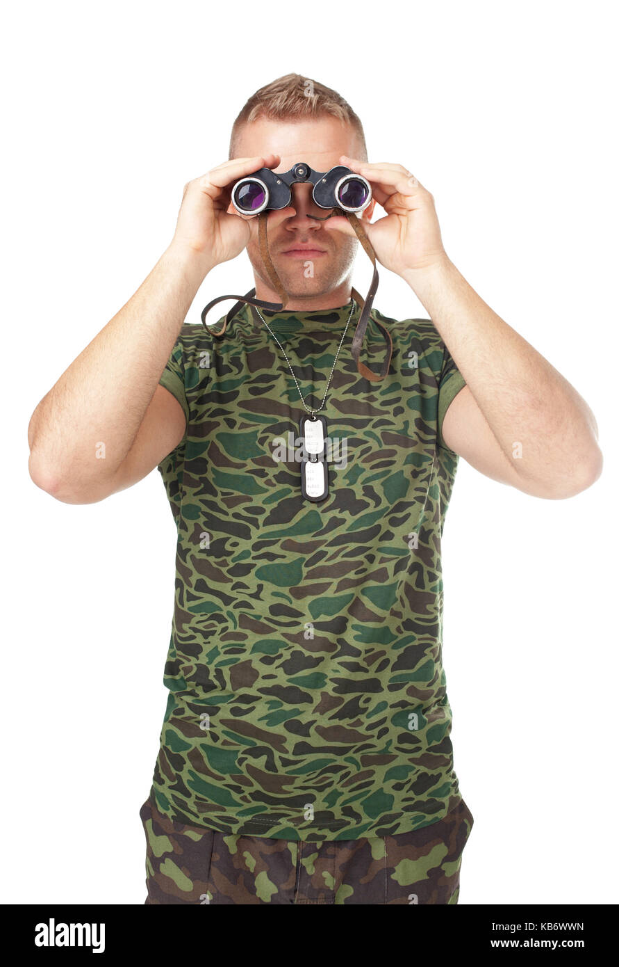 Young army soldier looking through binoculars isolated on white ...