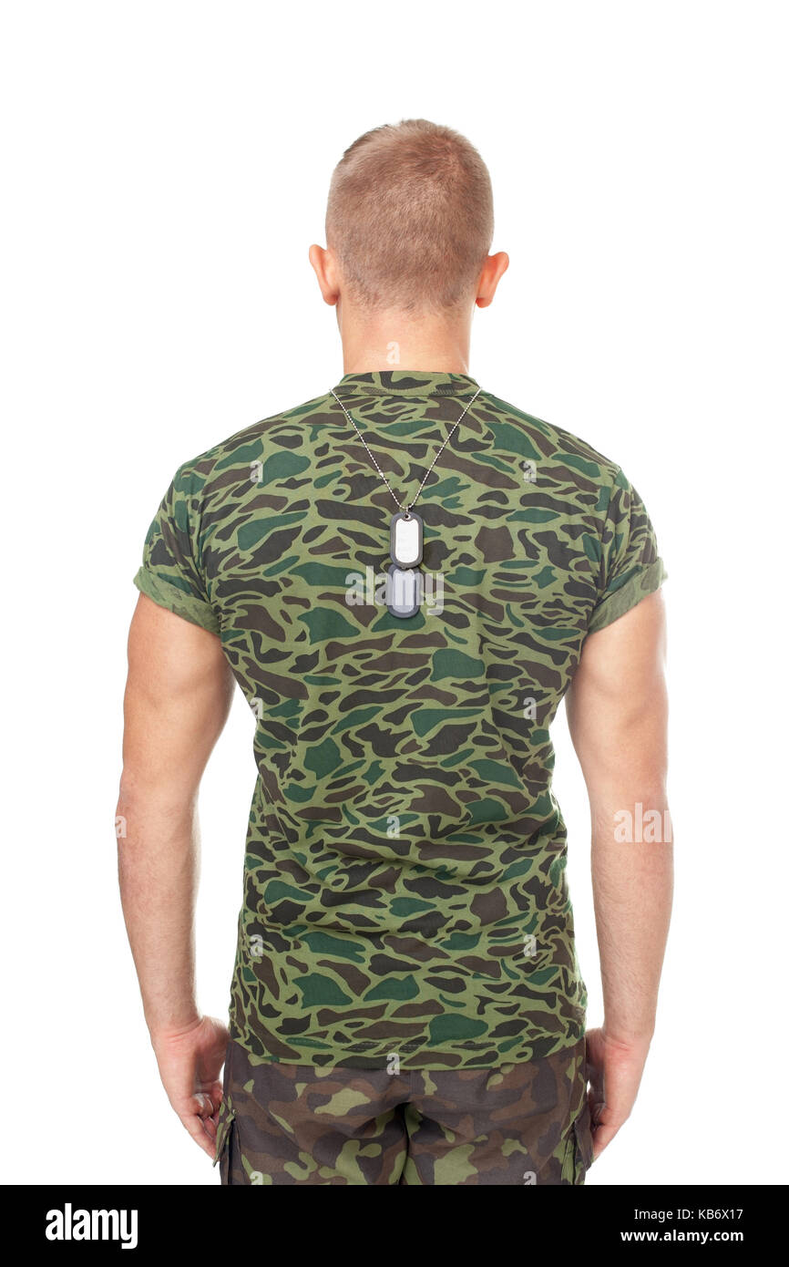 Back view of army soldier standing in attention with military ID tags ...