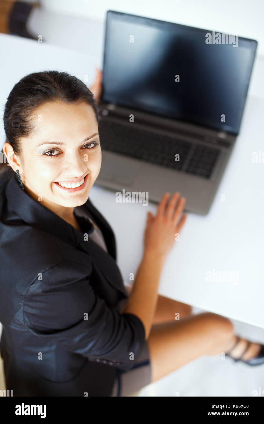 Top view portrait of beautiful young smiling brunette business woman ...