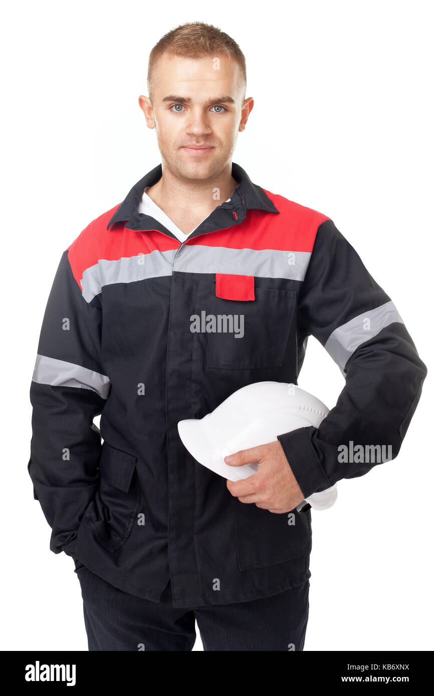Portrait of young smiling engineer holding white helmet isolated on ...