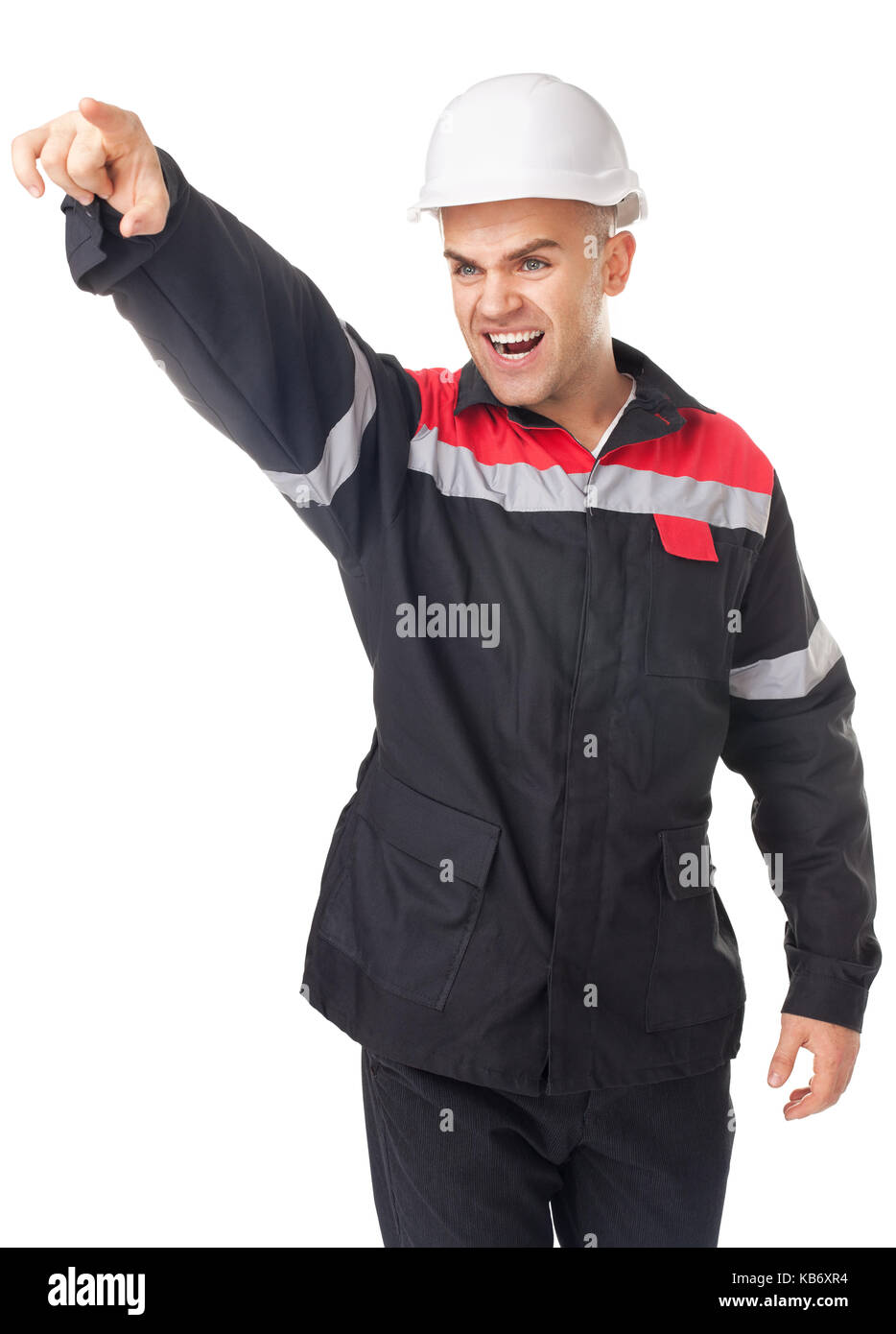 Portrait of young angry engineer shouting and pointing at something ...