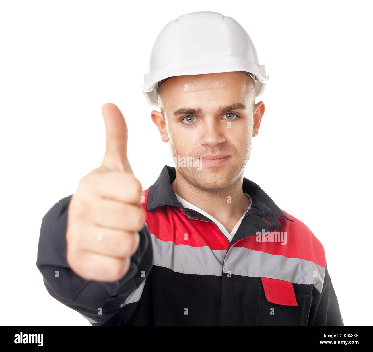 Portrait of young smiling engineer with thumb up isolated on white ...