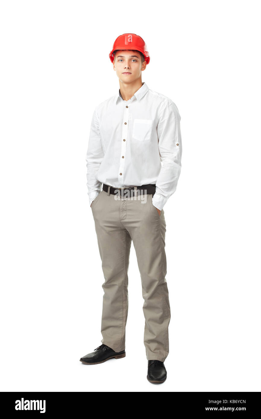 Full length portrait of young engineer wearing a red helmet isolated on ...