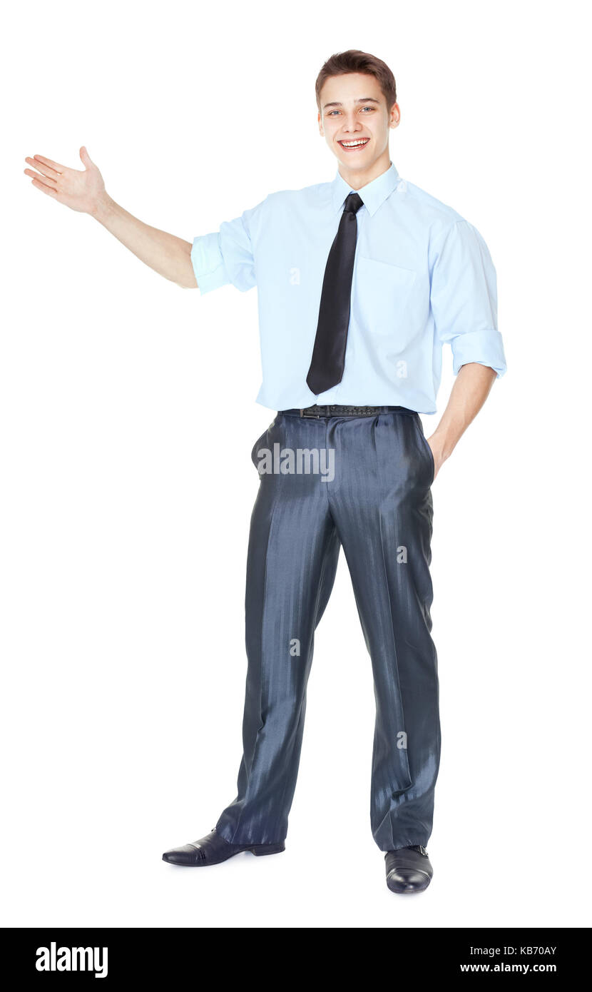 Full length portrait of young successful businessman showing a copy ...