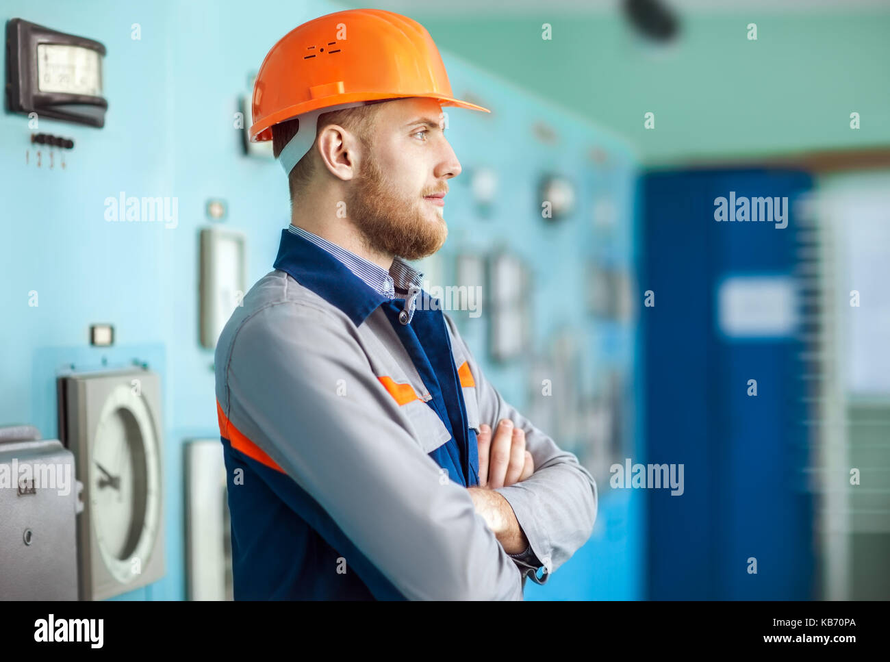 Profile of young engineer at workplace in factory Stock Photo - Alamy