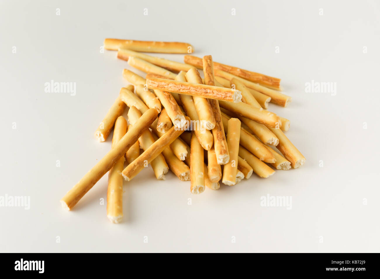 Crispy flour sticks lined on a white background Stock Photo - Alamy